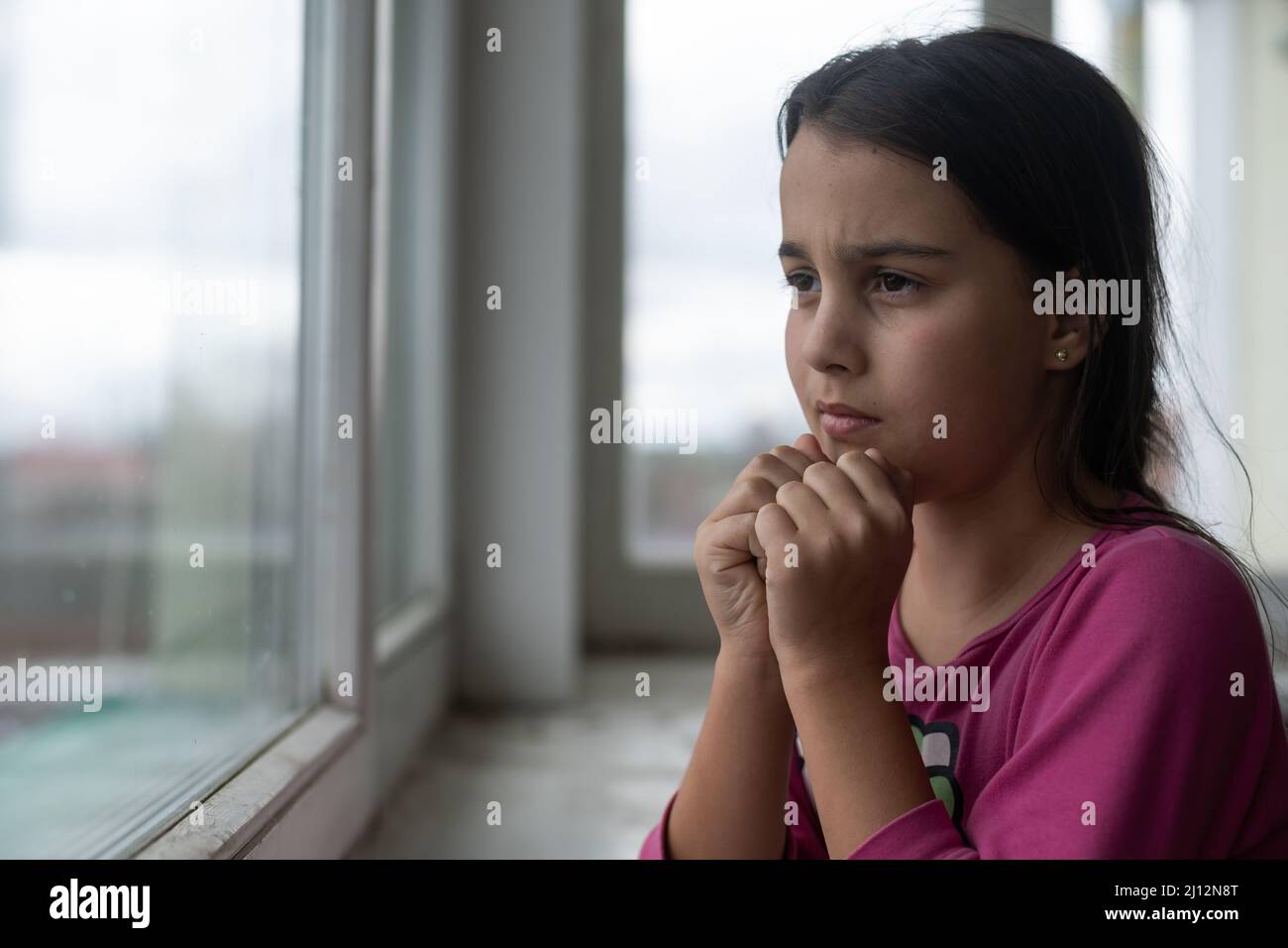 little girl praying near the window Stock Photo - Alamy