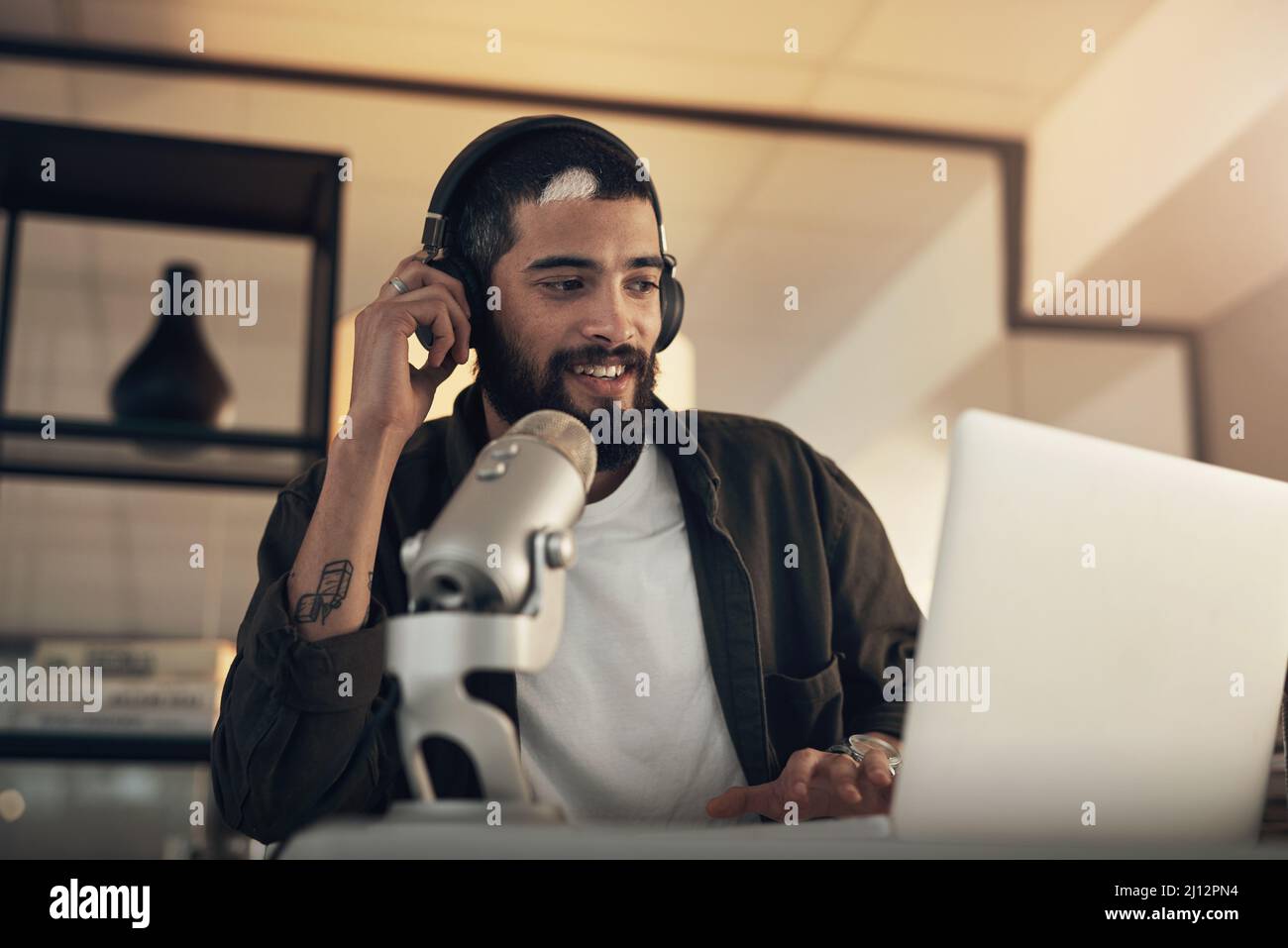 Stay tuned for more awesome topics. Shot of a young man using a headset ...