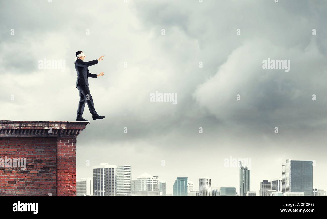 Danger and risk concept with businessman making step from edge Stock ...