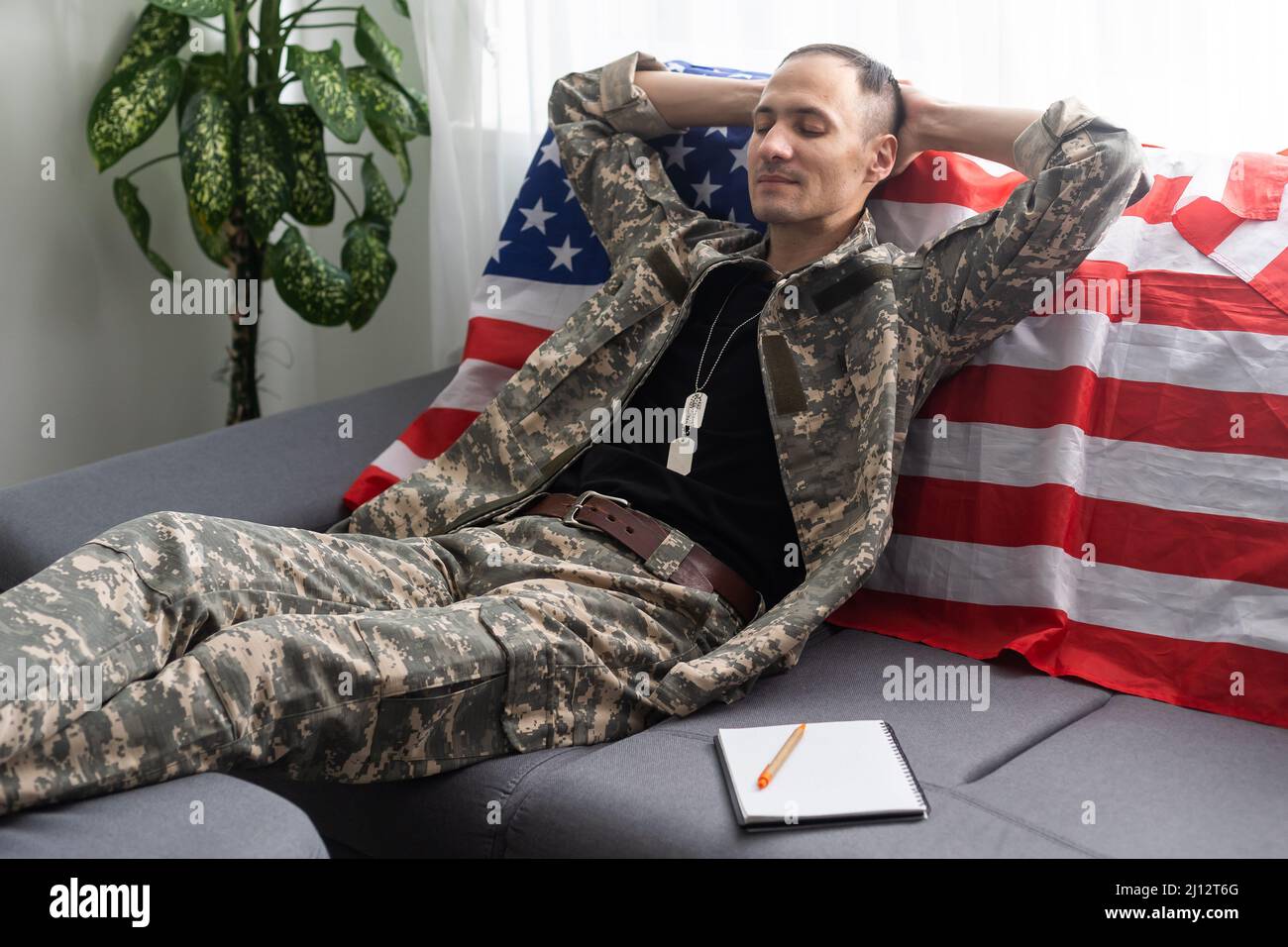 Young American soldier sitting and taking notes Stock Photo - Alamy