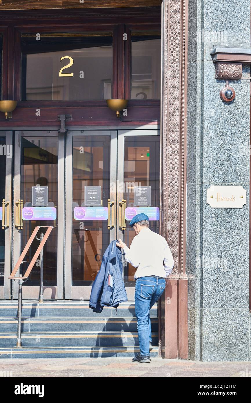 A man enters the expensive and luxury good shop of Harrods, Kensington ...