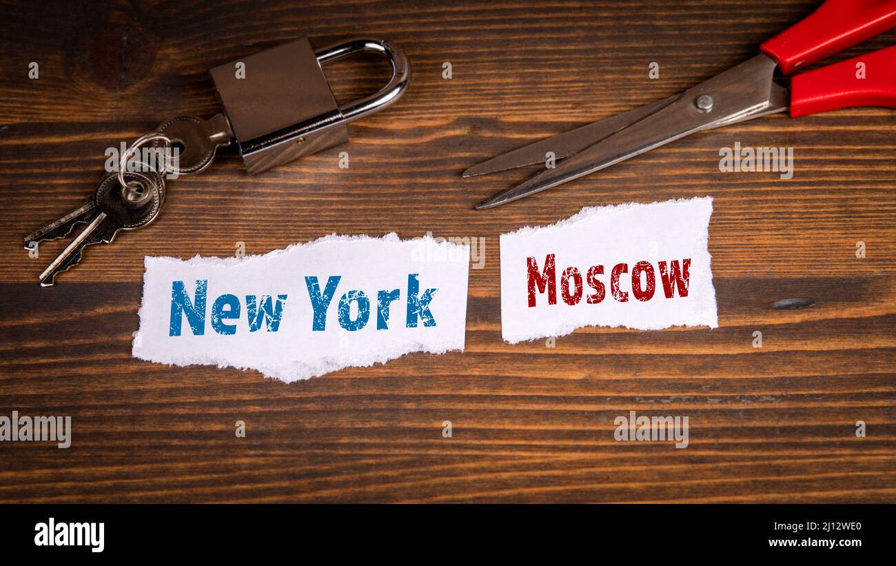 New York and Moscow. Sanctions and travel bans concept. Cut sheet of ...