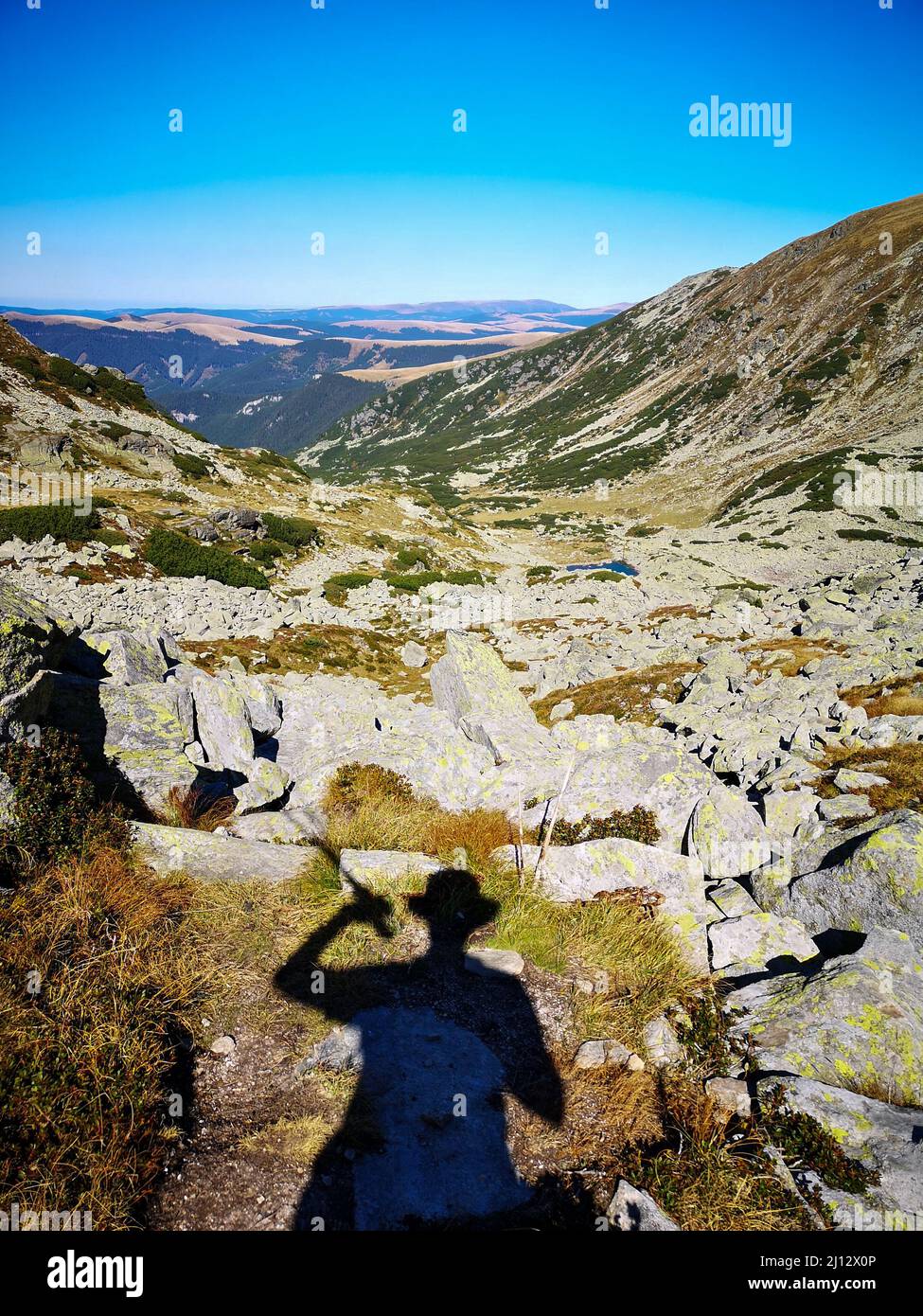 Shadow of a person on the rocks in mountains Stock Photo - Alamy