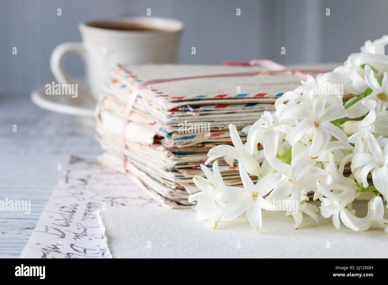 Stack of vintage letters and hyacinth flower. Retro style Stock Photo ...