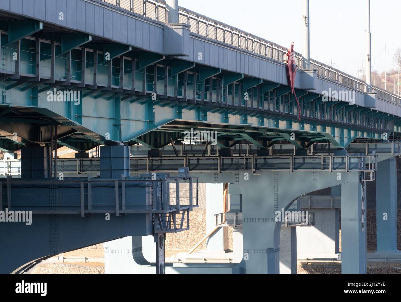 A road bridge over the river. Structures of the automobile bridge from ...