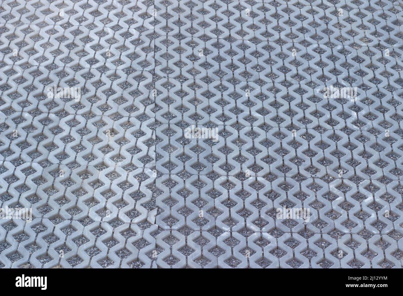 Eco-parking. Lawn grating for parking made of concrete Stock Photo - Alamy