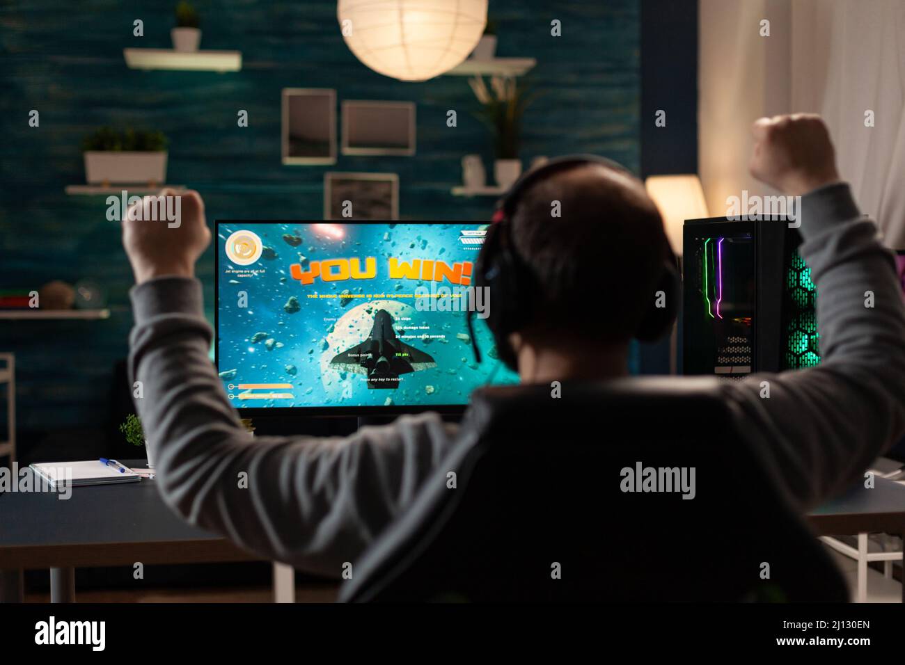 Professional gamer celebrating after hi-res stock photography and ...