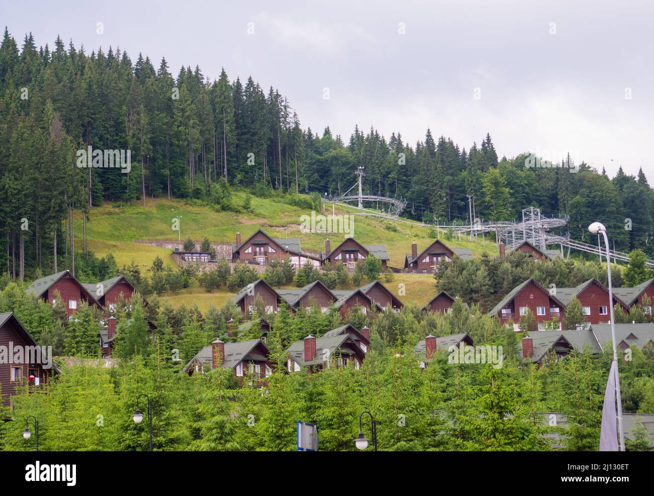 Summer view of mountain ski resort with house cottages in Bukovel ...