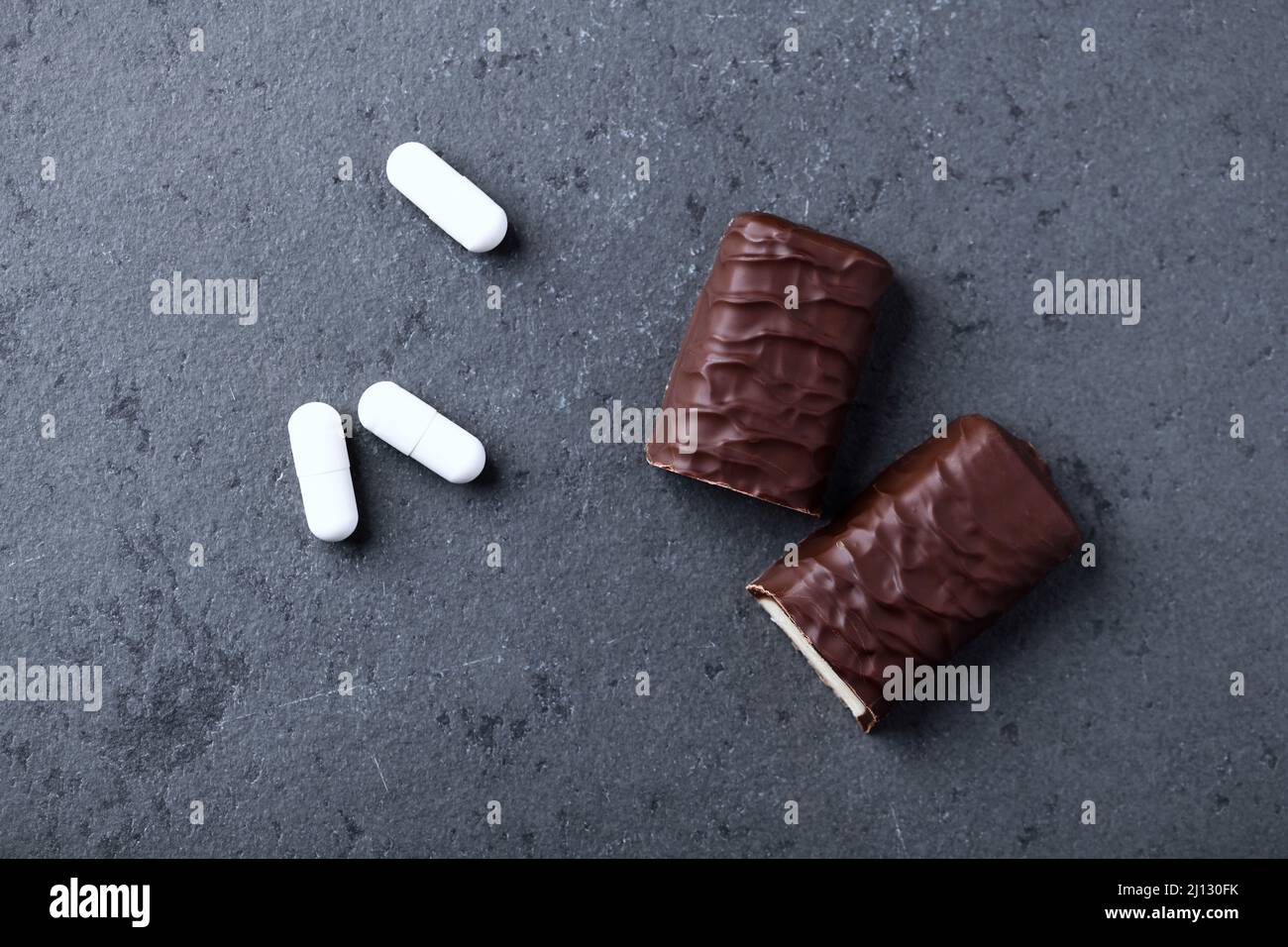 High Protein bar and creatine capsules. Bodybuilding food supplements ...