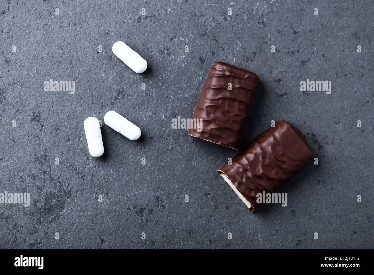 High Protein bar and creatine capsules. Bodybuilding food supplements ...