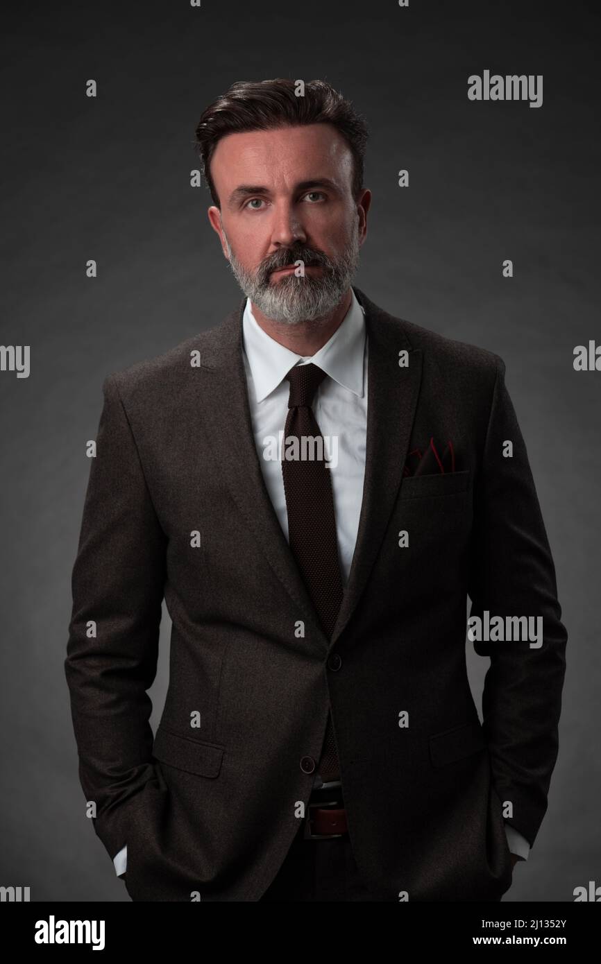 Portrait of a stylish elegant senior businessman with a beard and ...