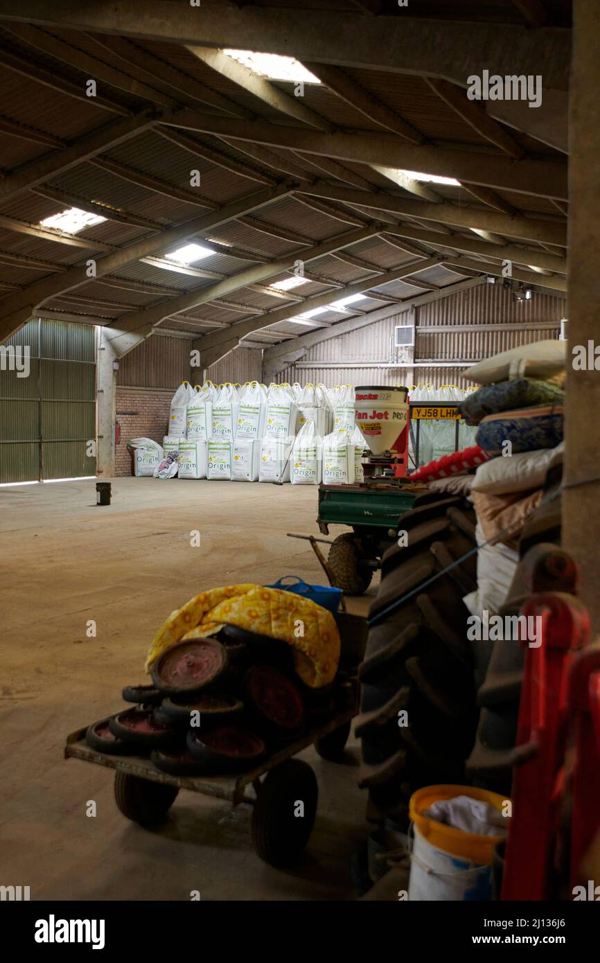 Nitrogen fertiliser is stored in a barn in large white sacks Stock ...