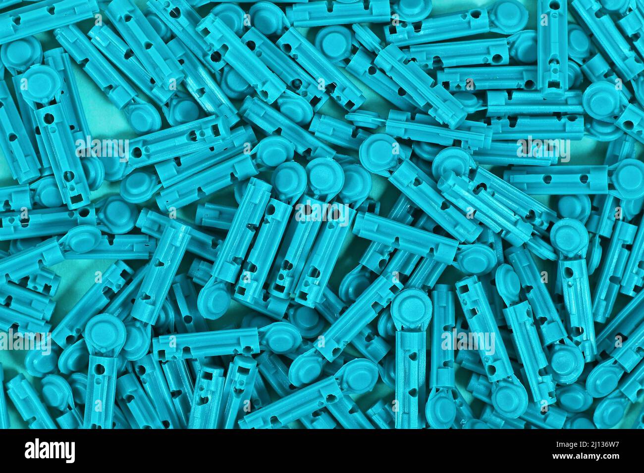 Many blue disposable diabetes lancets used to draw blood for testing ...