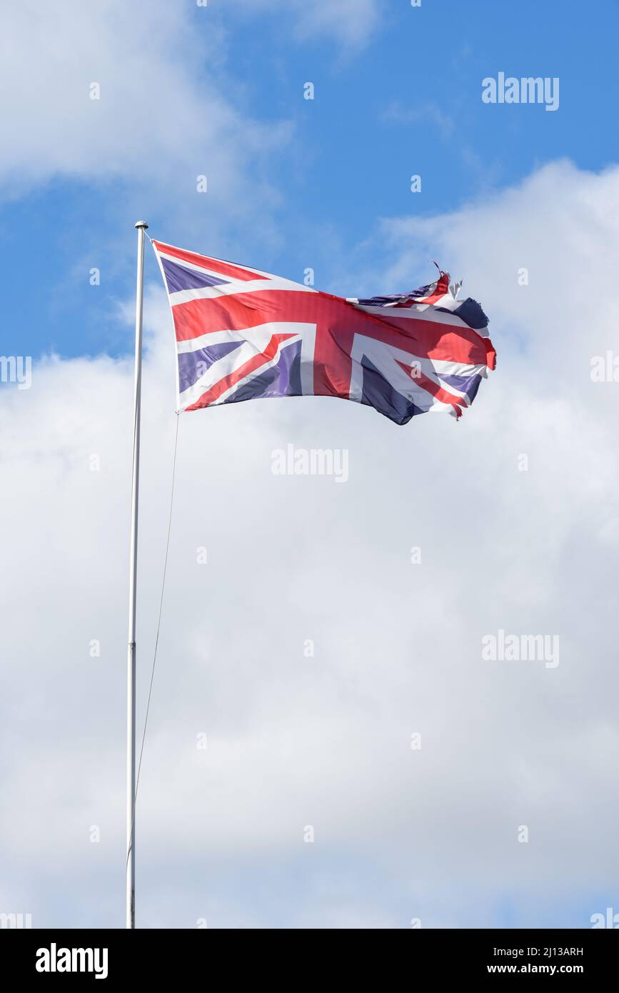 Union Jack flag of United Kingdom flyiing with ripped edges Stock Photo ...