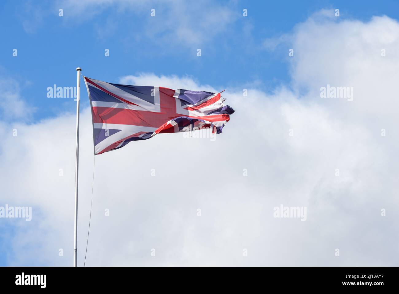 Union Jack flag of United Kingdom flyiing with ripped edges Stock Photo ...