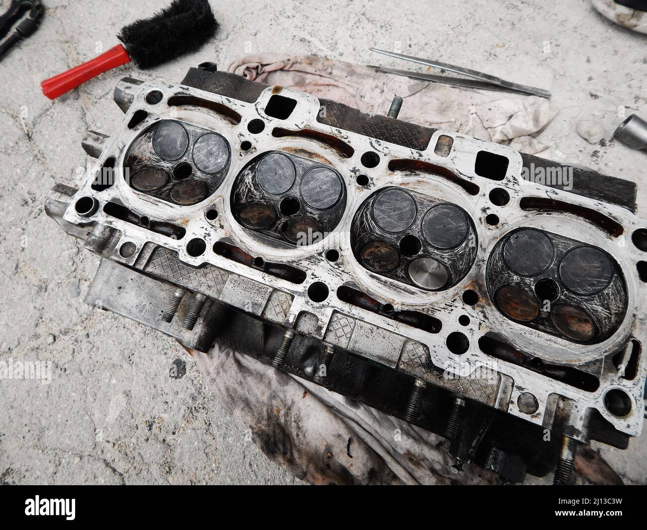 Replacing a valve in a car engine. Valve block of the engine of the car ...