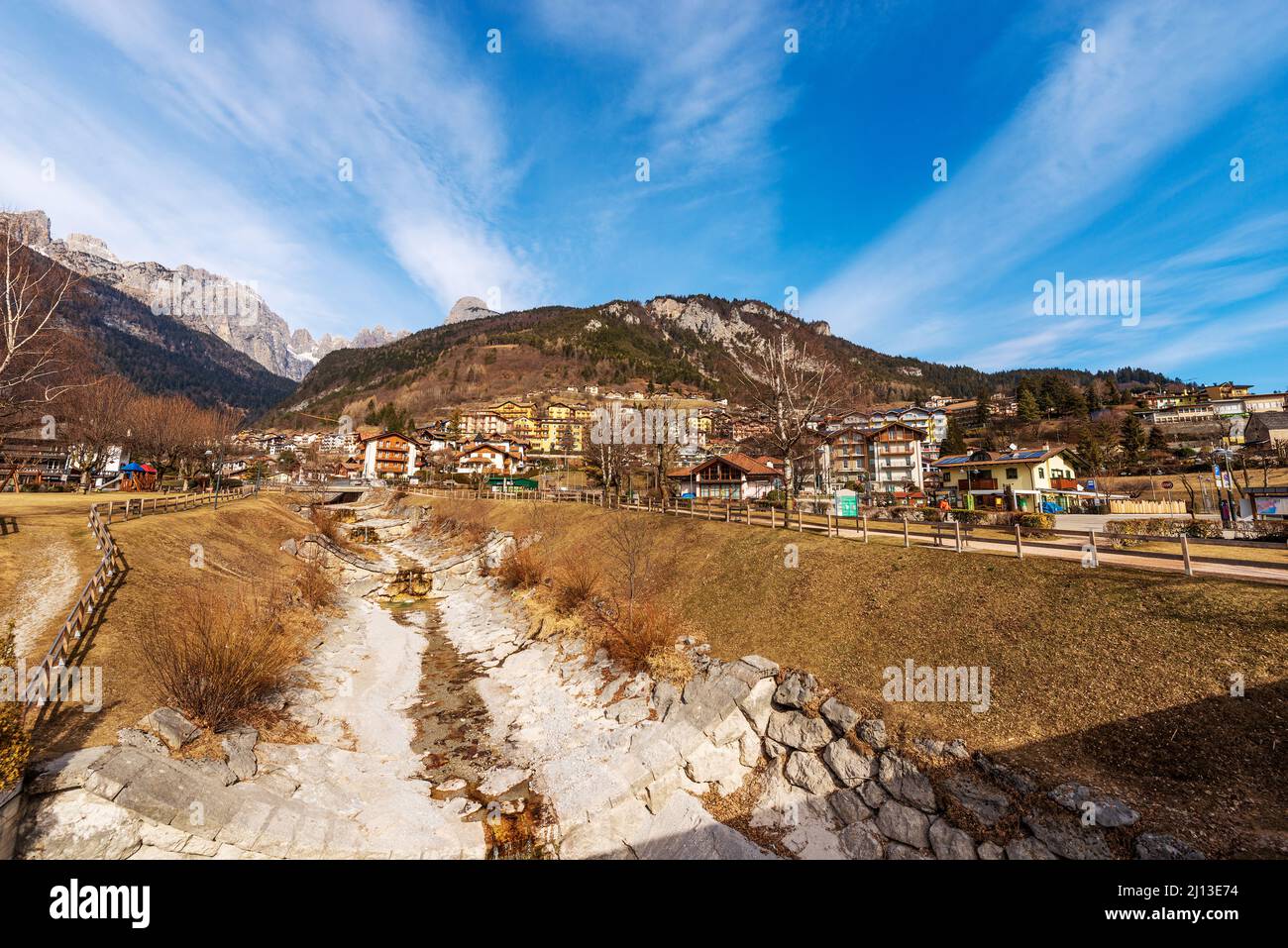 Molveno village, mountain range of Brenta Dolomites in winter. Tourist ...