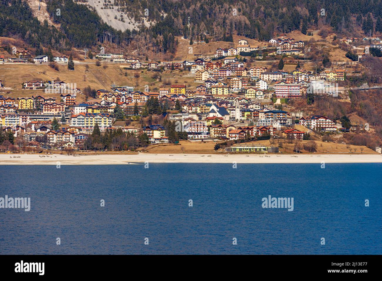 Molveno village, tourist resort on the coast of the lake Molveno ...