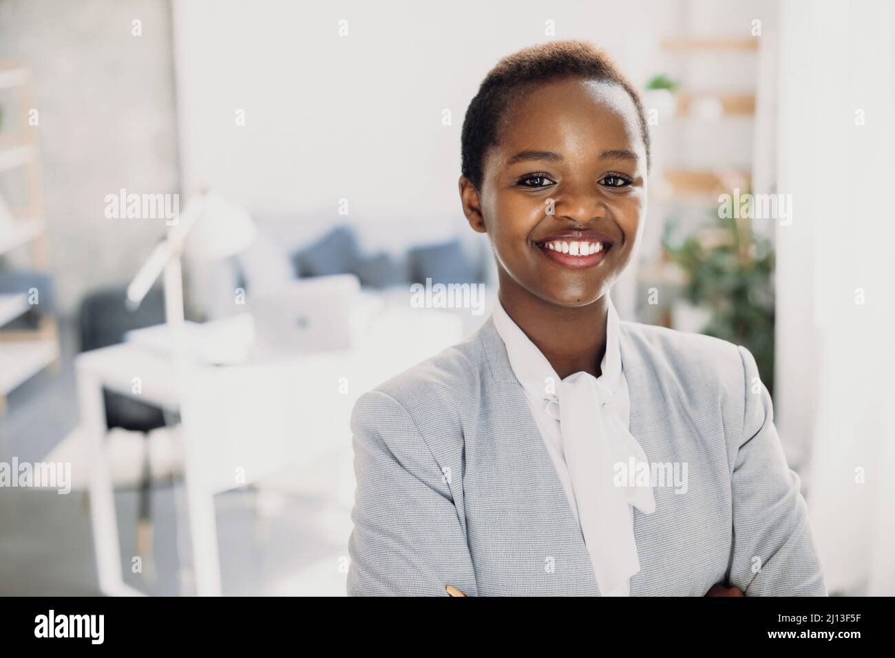 African american business executive posing standing with arms folded ...