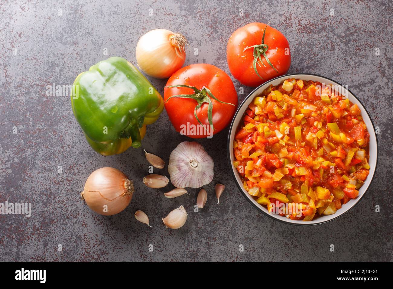 Sofrito base sauce from fresh vegetables close-up in a bowl on the ...
