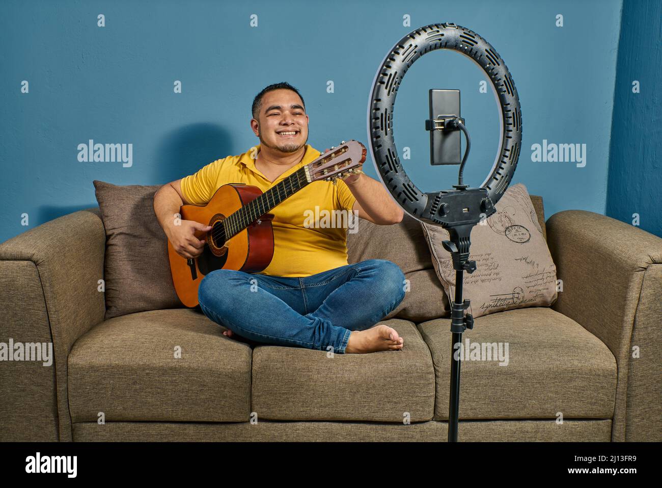Teaching guitar in online courses with live lessons Stock Photo - Alamy