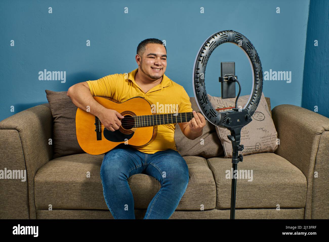 Teaching guitar in online courses with live lessons Stock Photo - Alamy