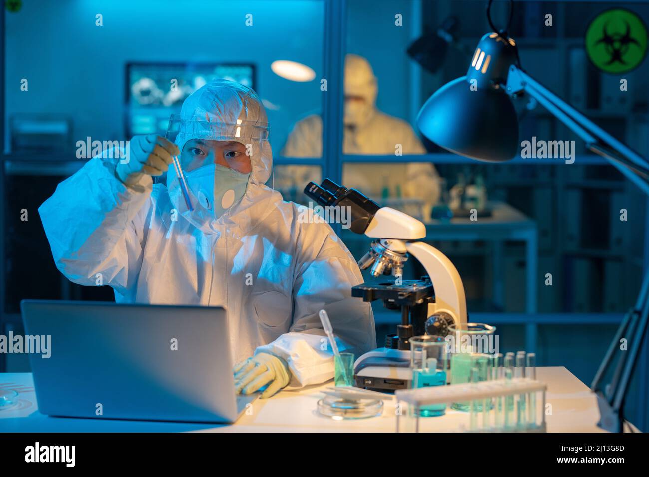 Female researcher in protective suit hi-res stock photography and ...
