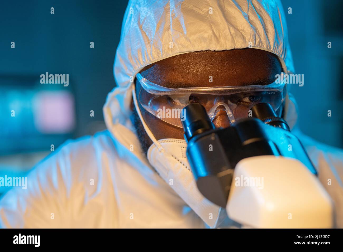 Scientist work looking in microscope hi-res stock photography and ...