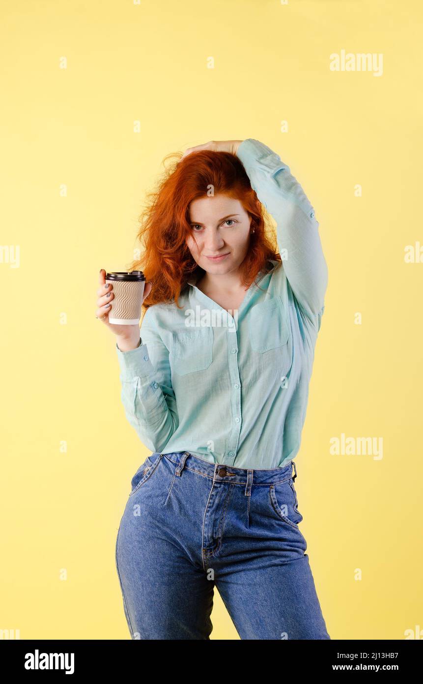 Business Portrait Of Beautiful Young Woman With Red Curly Hair And Blue