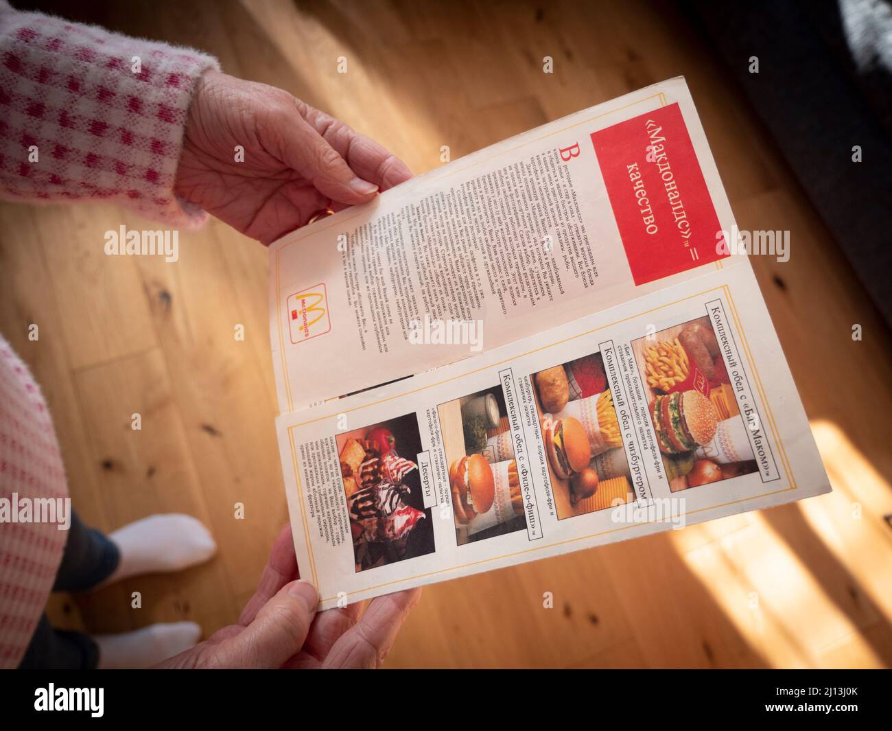 Female holding first Russian Mcdonalds menu, from 1990 Stock Photo - Alamy