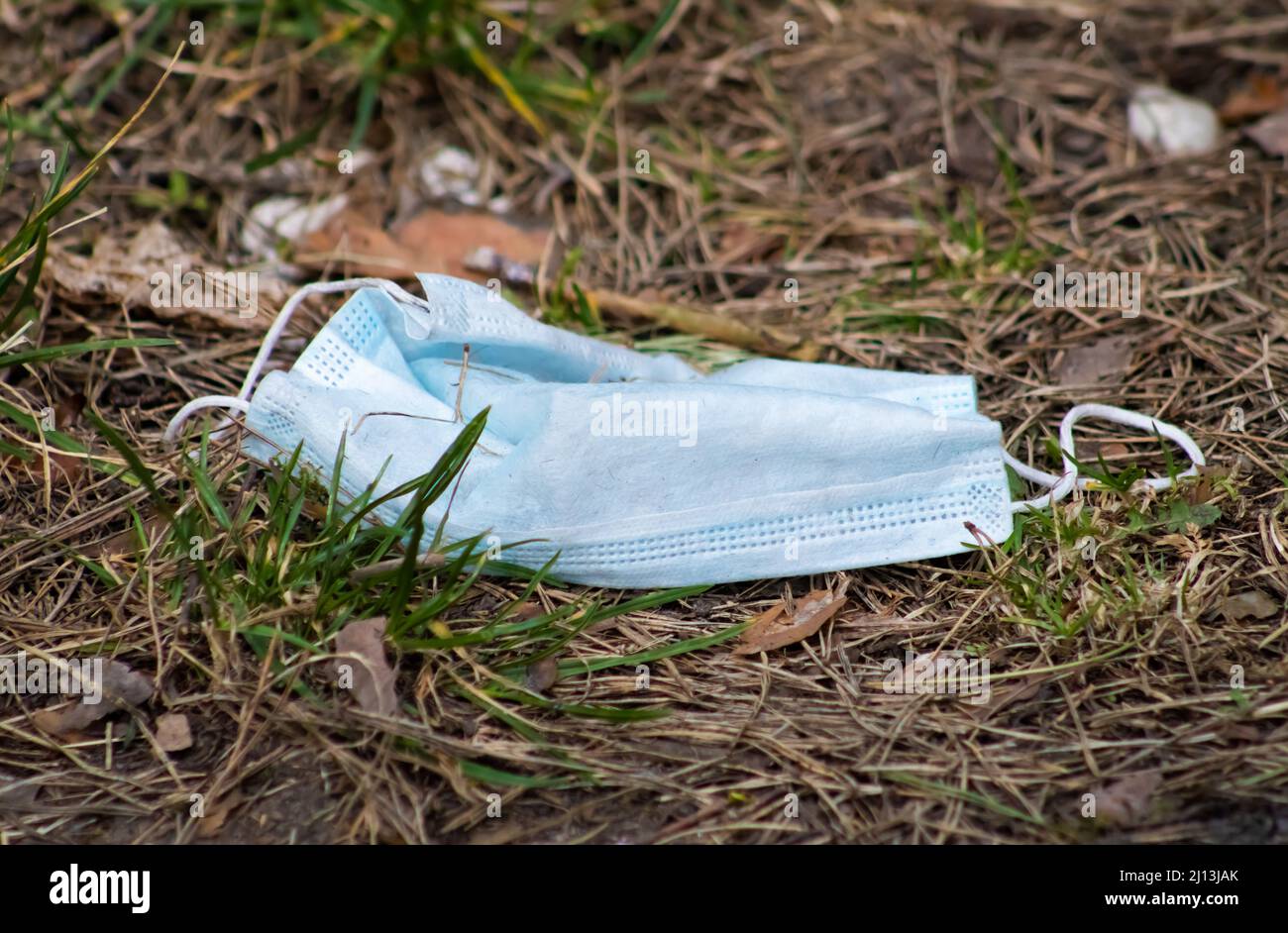 People littering of garbage of used medical masks throw in the crevices ...