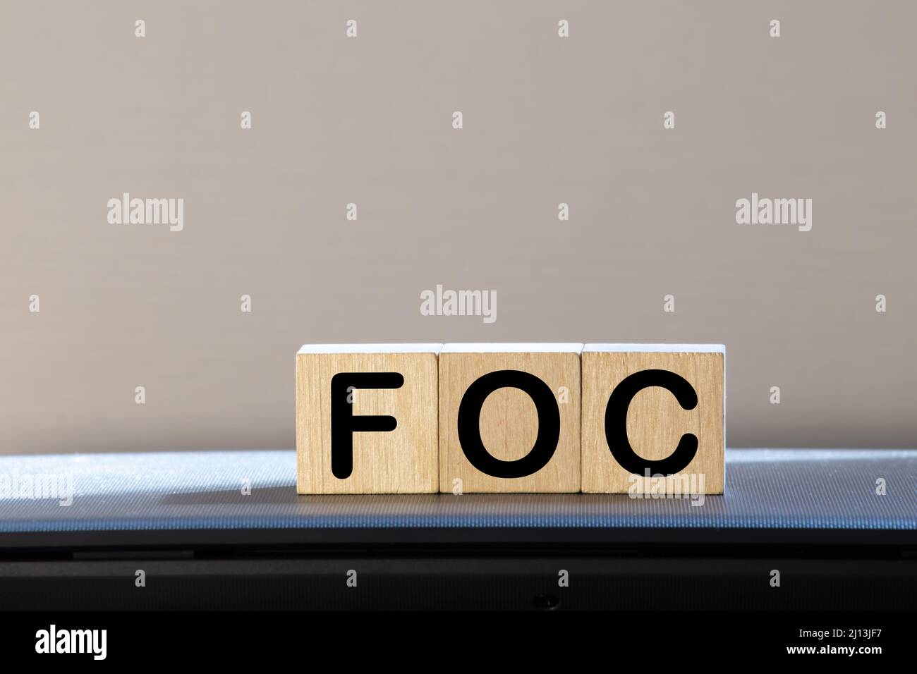 Alphabet letter in word FOC Abbreviation of Free of charge on wood ...