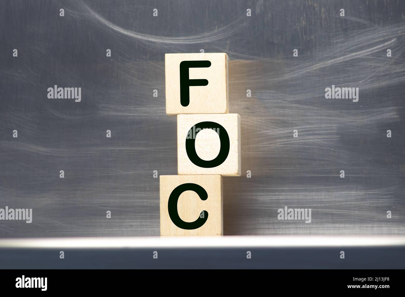 Alphabet letter in word FOC Abbreviation of Free of charge on wood ...