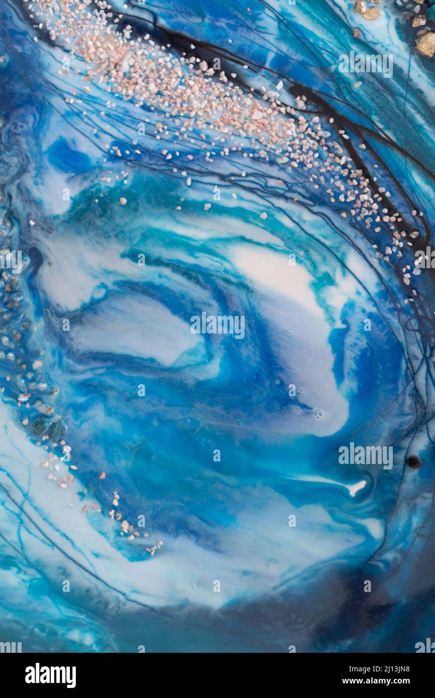 Epoxy resin art. Texture of blue and white paint. Fluid art, kintsugi ...