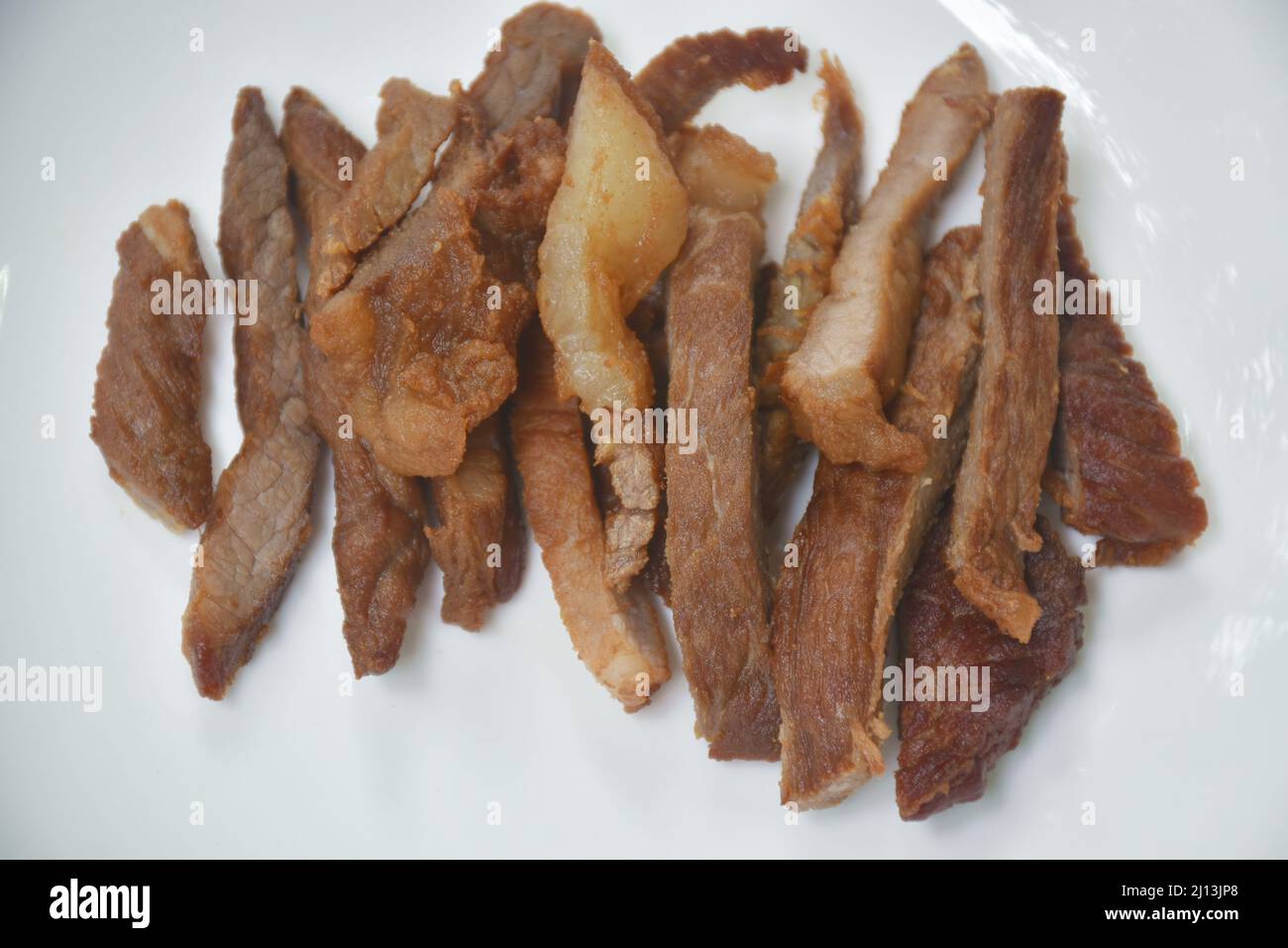 crispy fried salty beef meat and belly arranging on plate Stock Photo ...