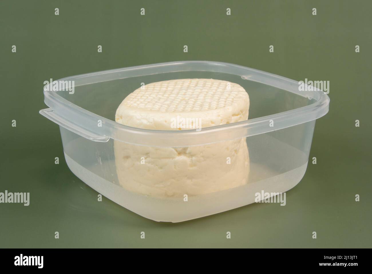 typical Brazilian Minas cheese from Minas Gerais in transparent plastic ...
