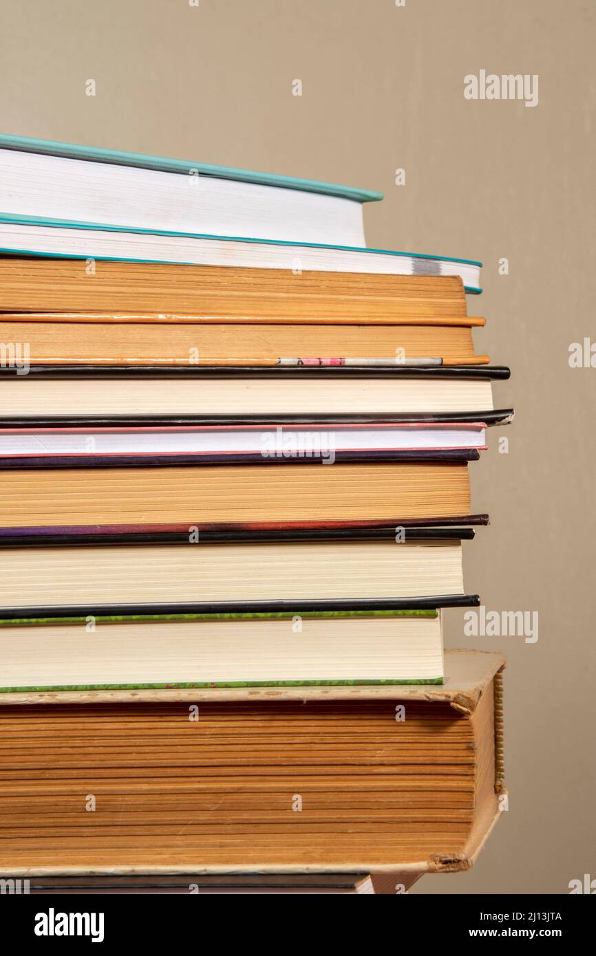 Close-up of background stack of old used books. Pile of vintage old ...