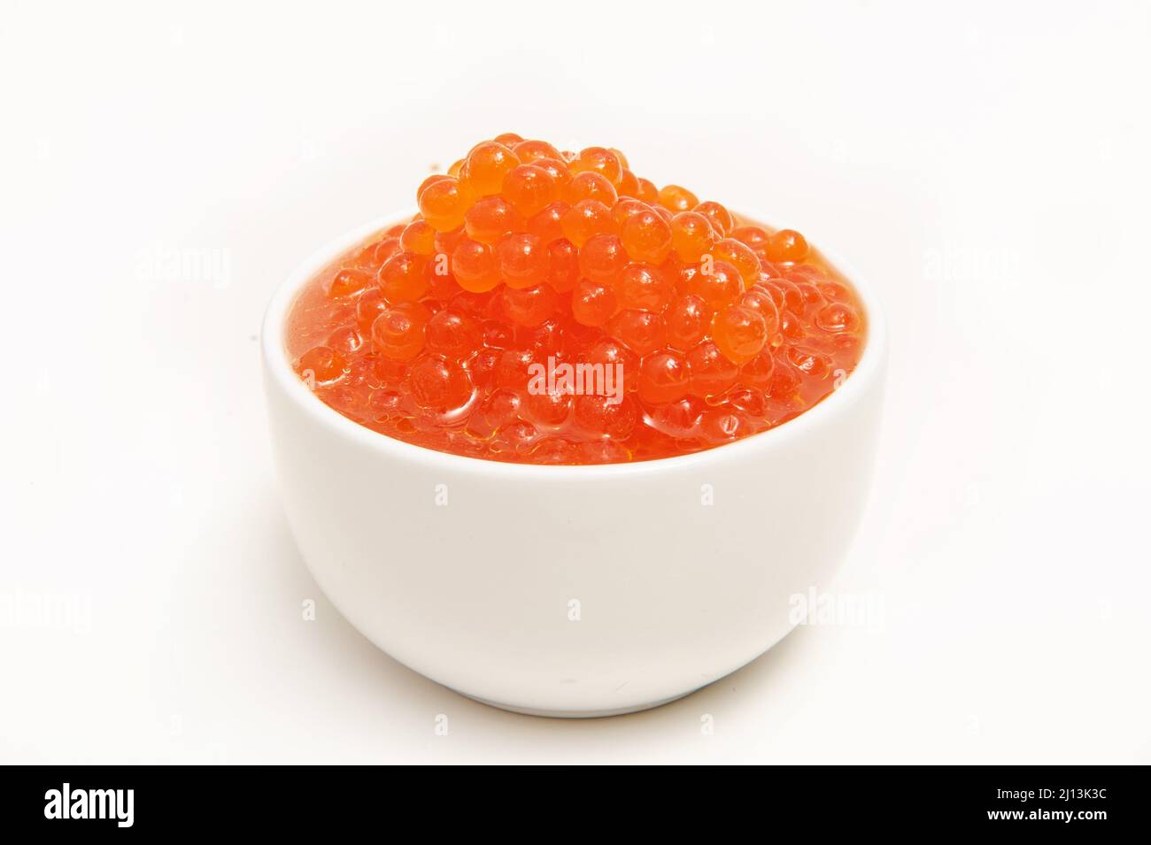 Bowl with red salmon caviar on a white background Stock Photo - Alamy