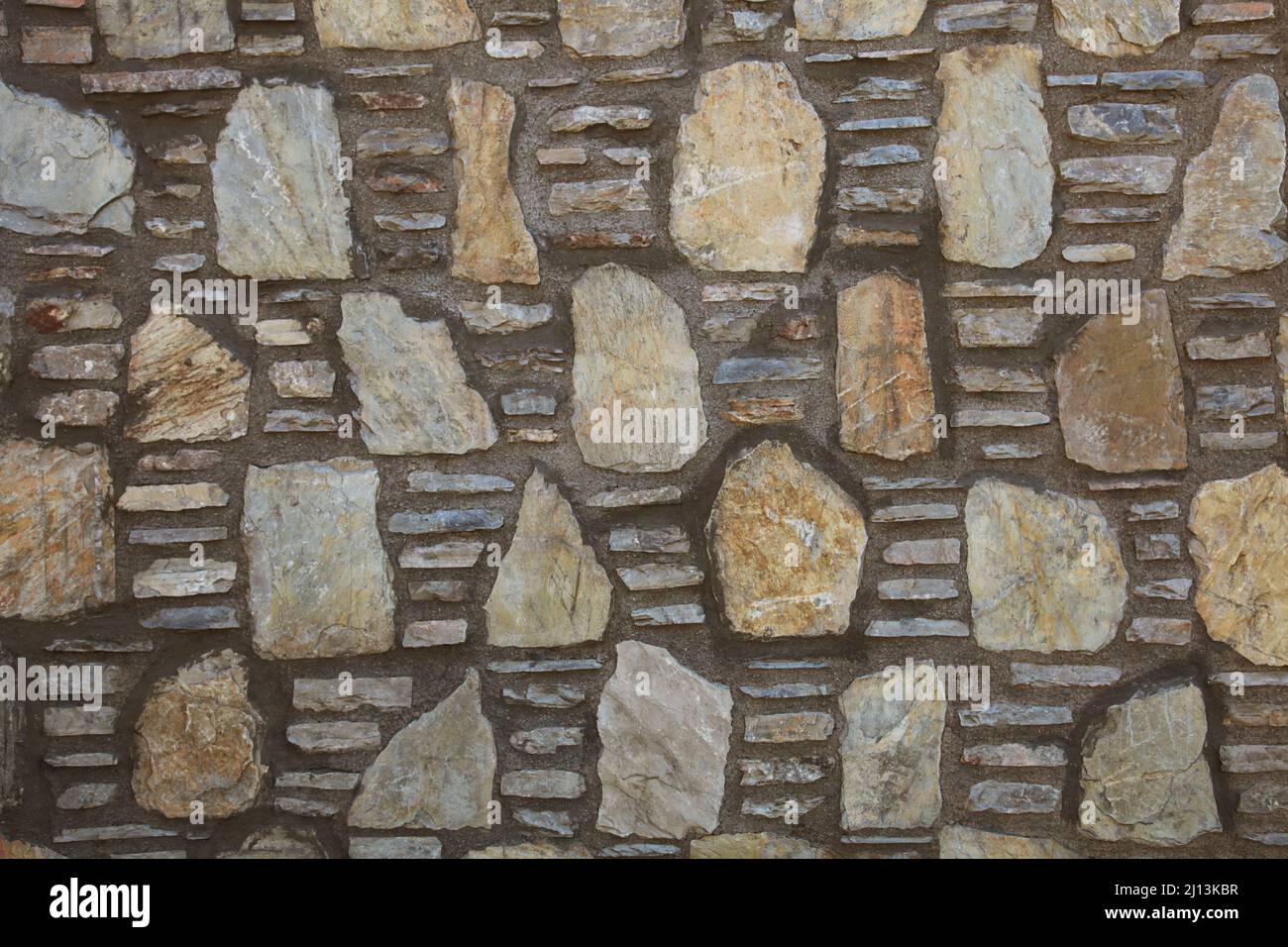 Symmetrical stone wall. Arranged in a perfect way. Beautiful stone ...