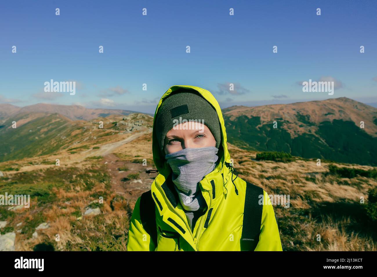 hiking woman with covered face Stock Photo - Alamy