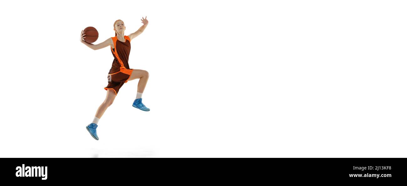 Portrait of professional teen basketball player in motion, training ...