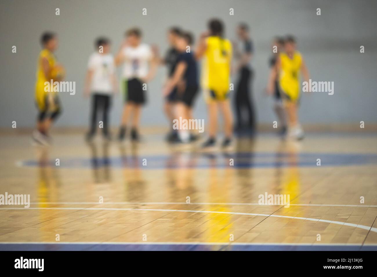 View of basketball court hall indoor venue with junior teenage school ...