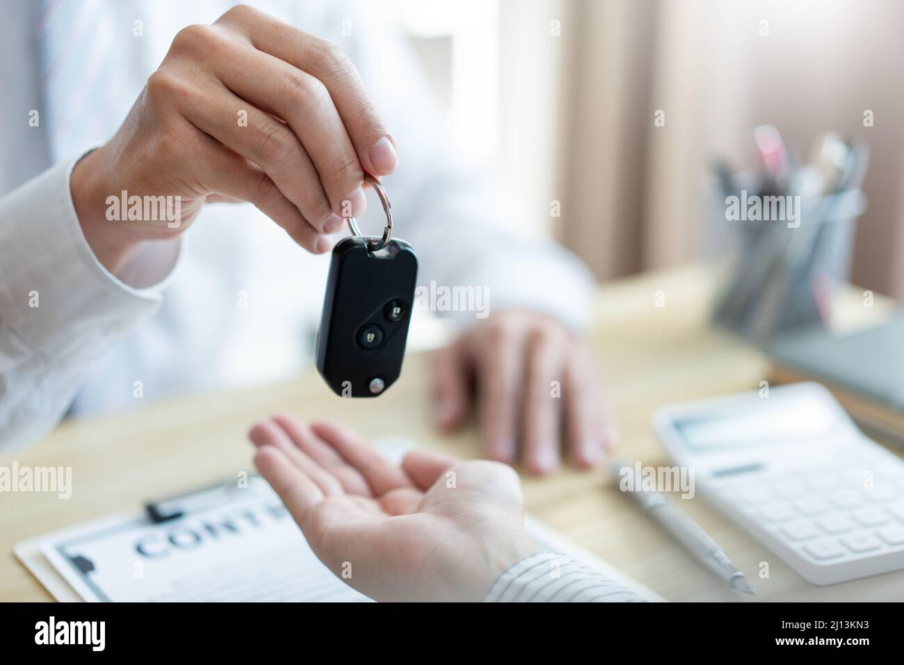 Insurance concept the customer receiving the car key after finishing ...