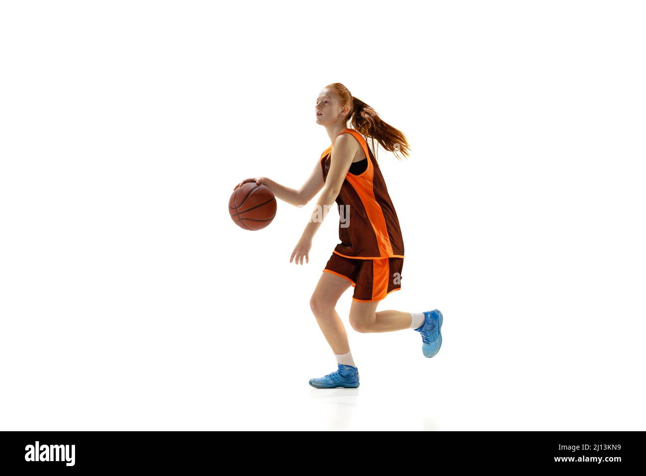 Portrait of young girl, teen, basketball player in motion, training ...