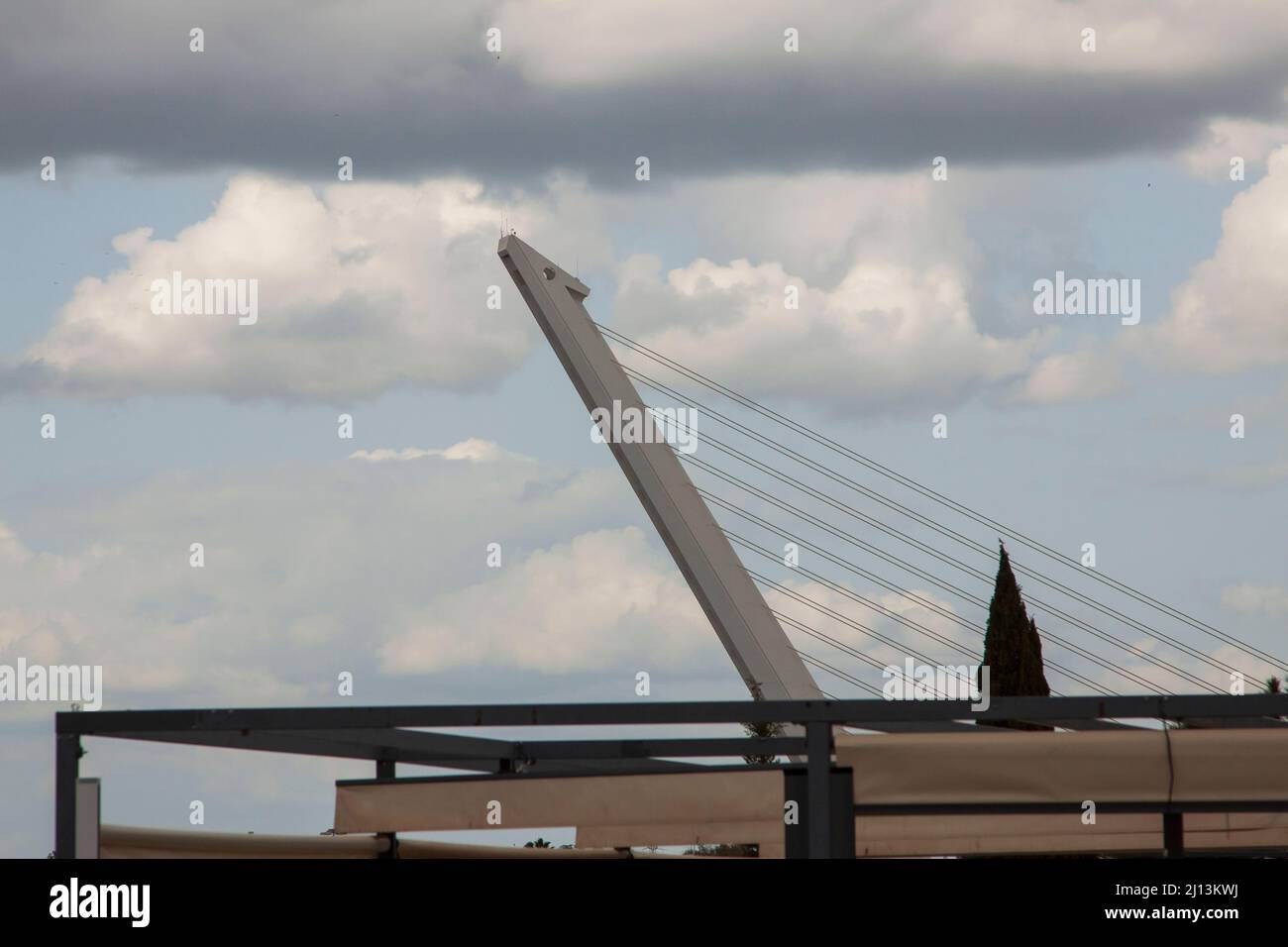 The modern bridge of El Alamillo over roofs in Seville, Spain Stock ...
