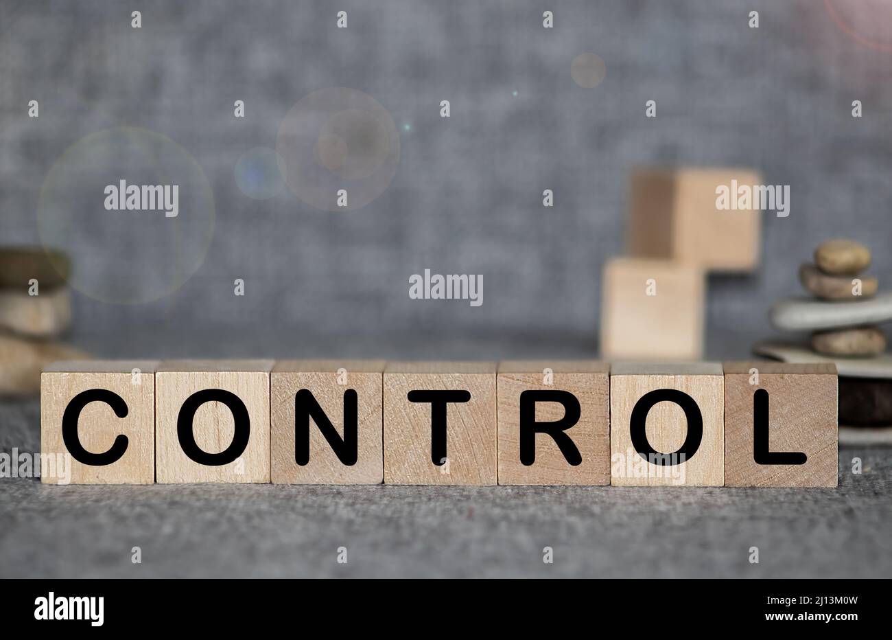 A man makes the word Control out of blocks. Business process management ...