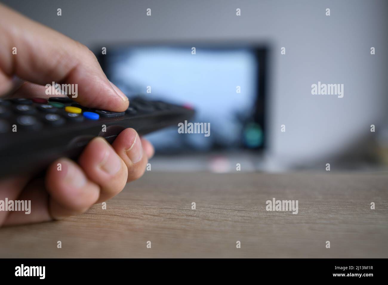 Changing channel television with great background blur Stock Photo - Alamy