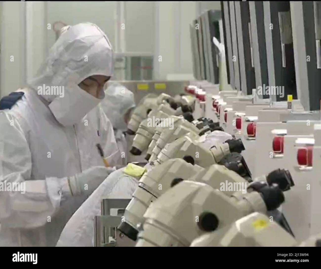 Shanghai. 22nd Mar, 2022. Employees work on a production line of Amkor ...
