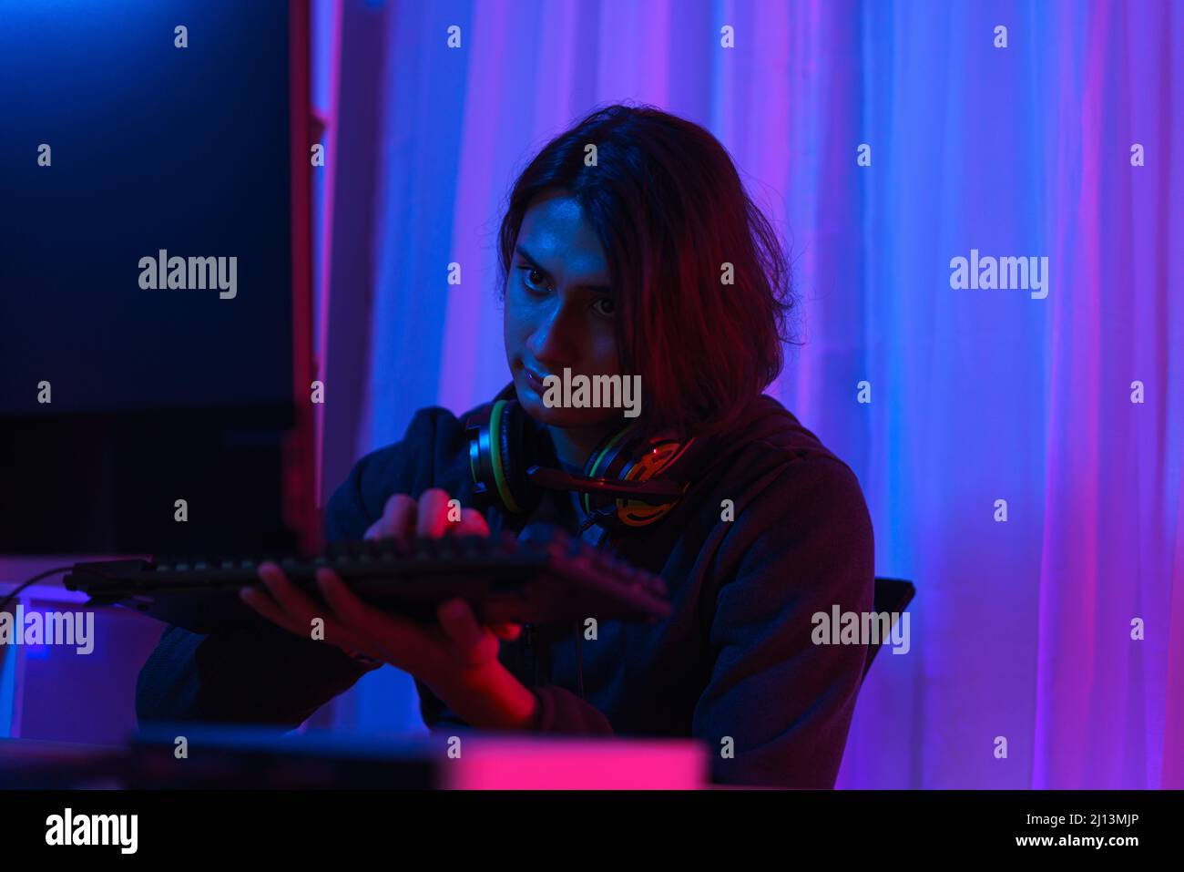 Gamer stream concept, Male streamer typing on keyboard to chat with ...