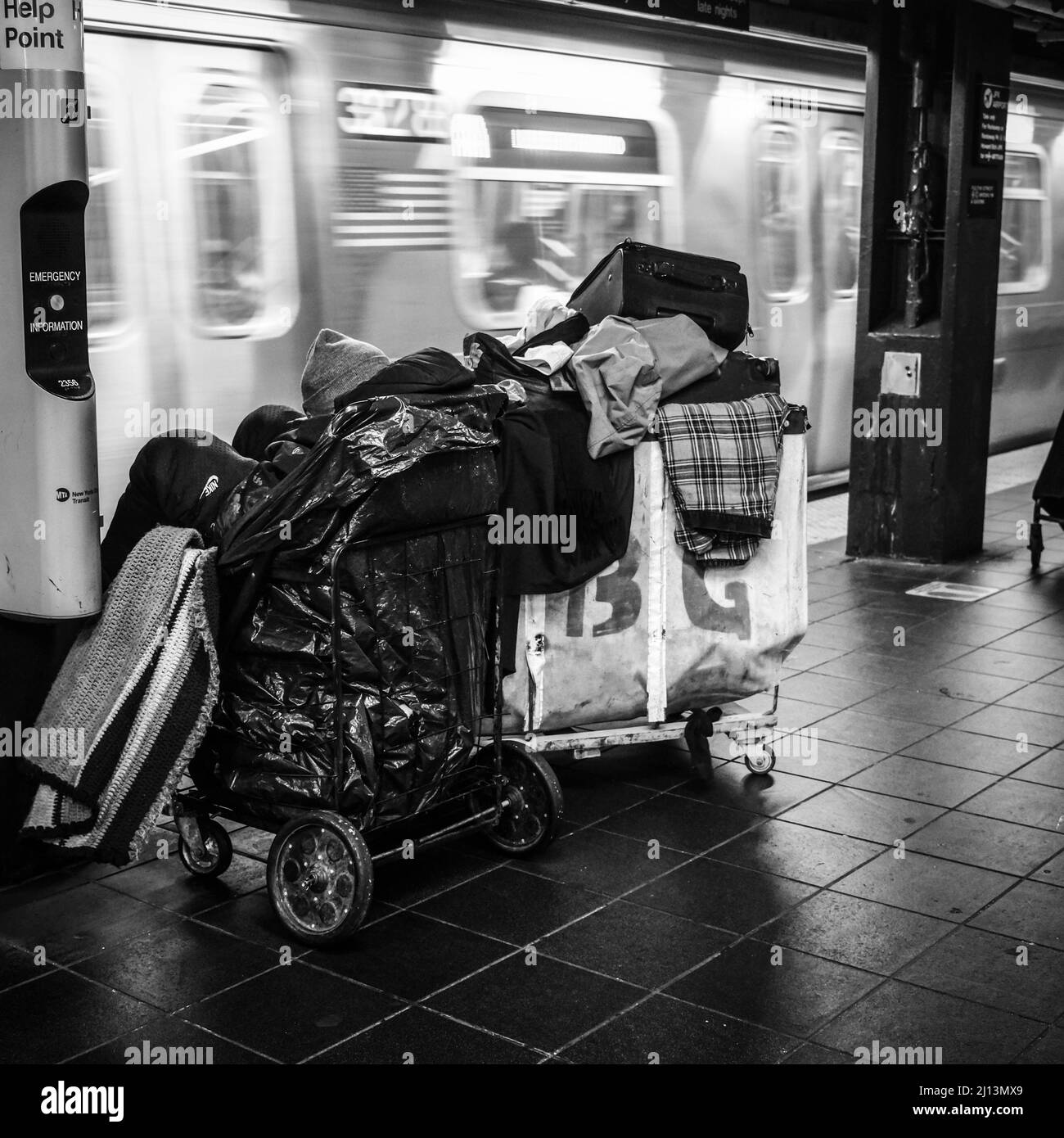 Photo of Homeless with shopping carts in subway Stock Photo - Alamy